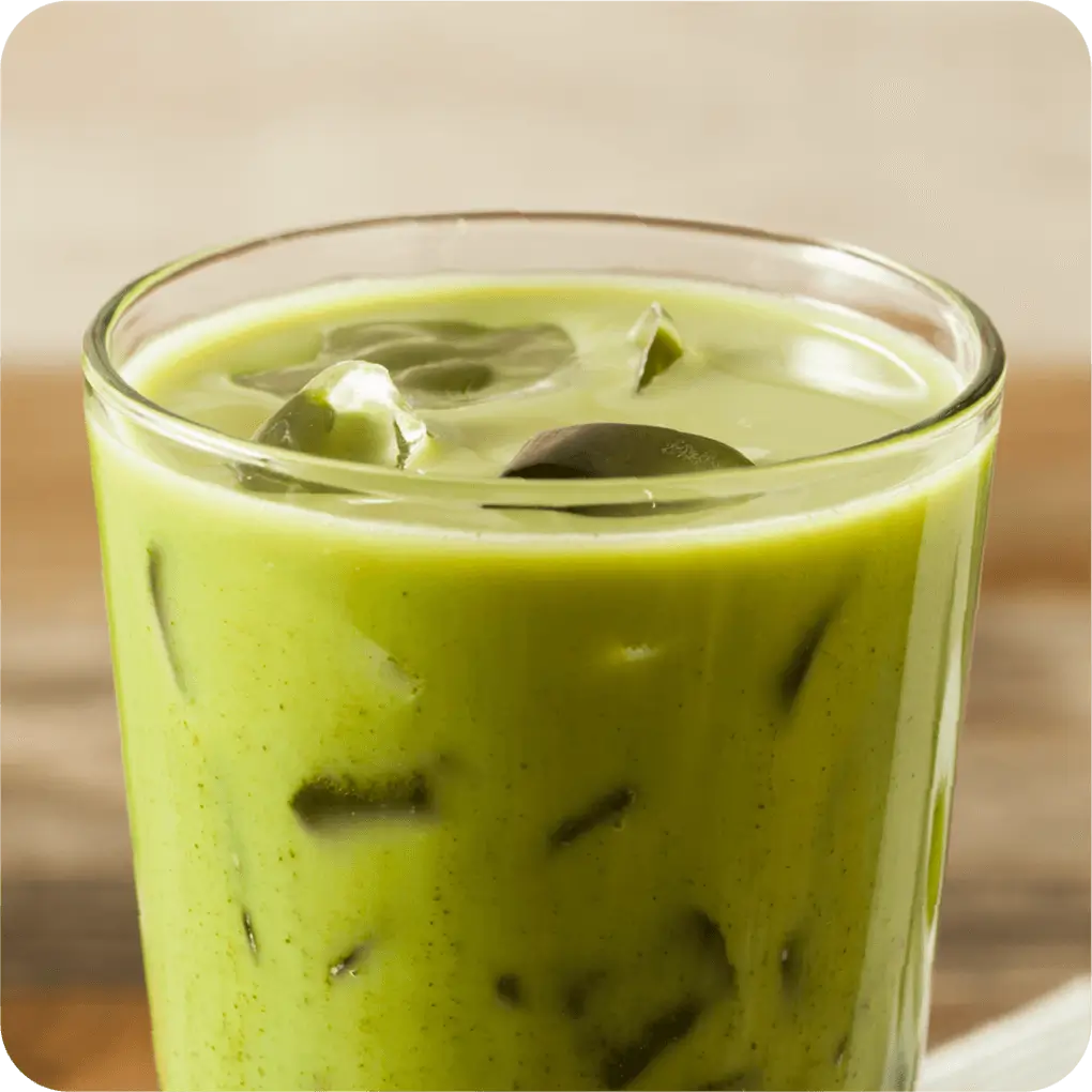 Glass of Unicity's Matcha Energy with ice